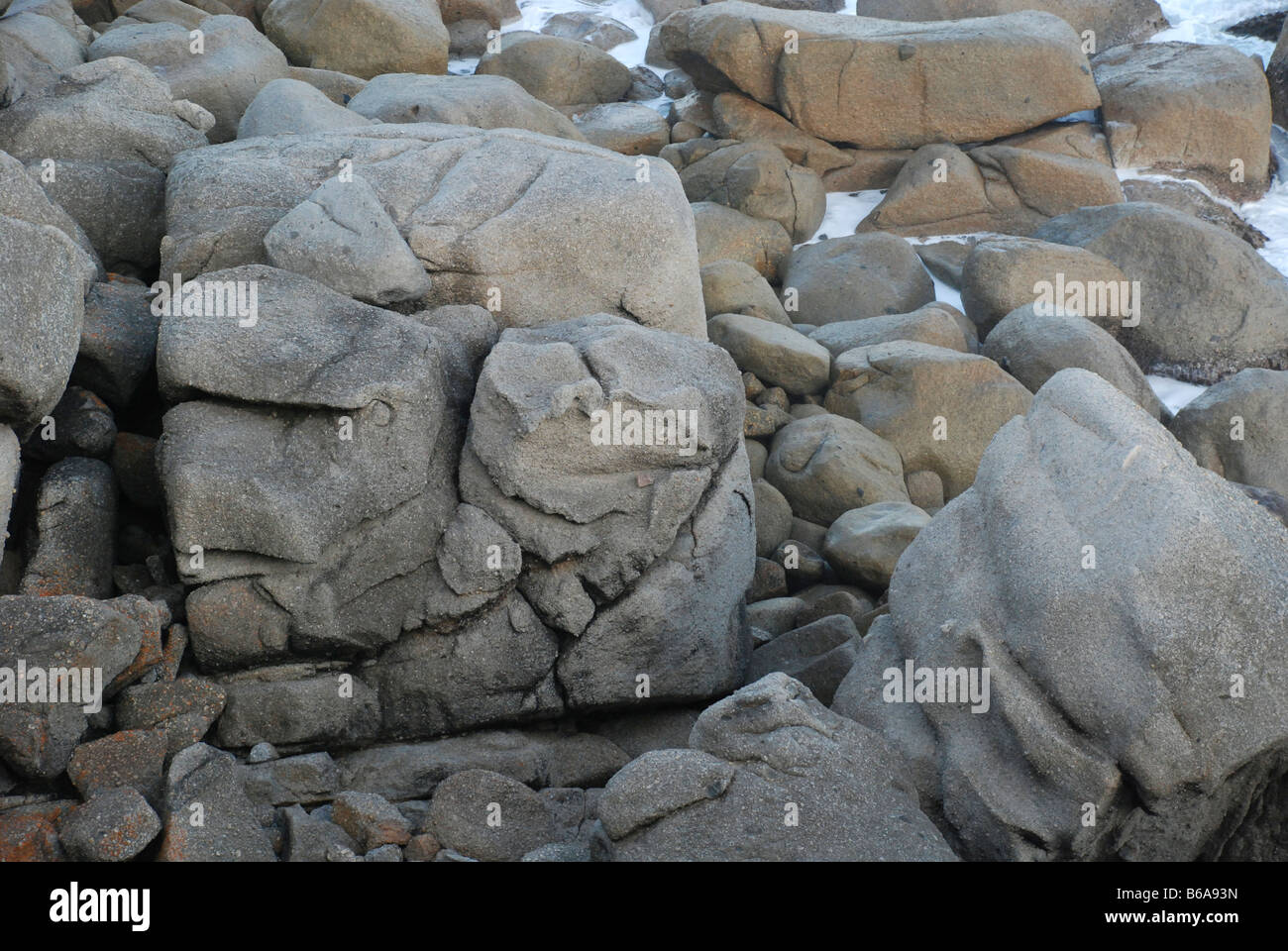 Different shapes of rocks on beach Stock Photo - Alamy