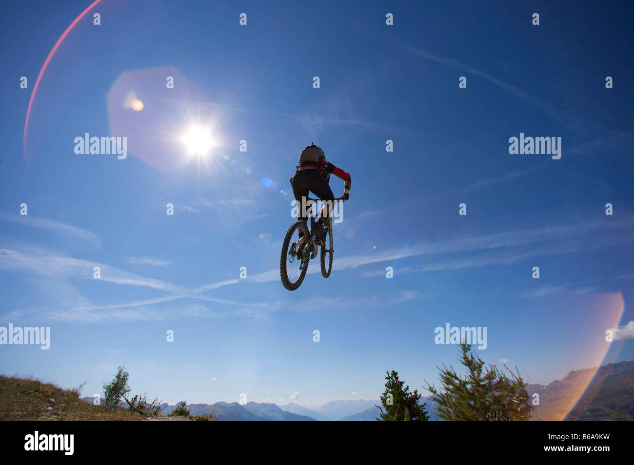 Mountain biker jumping over head Stock Photo - Alamy