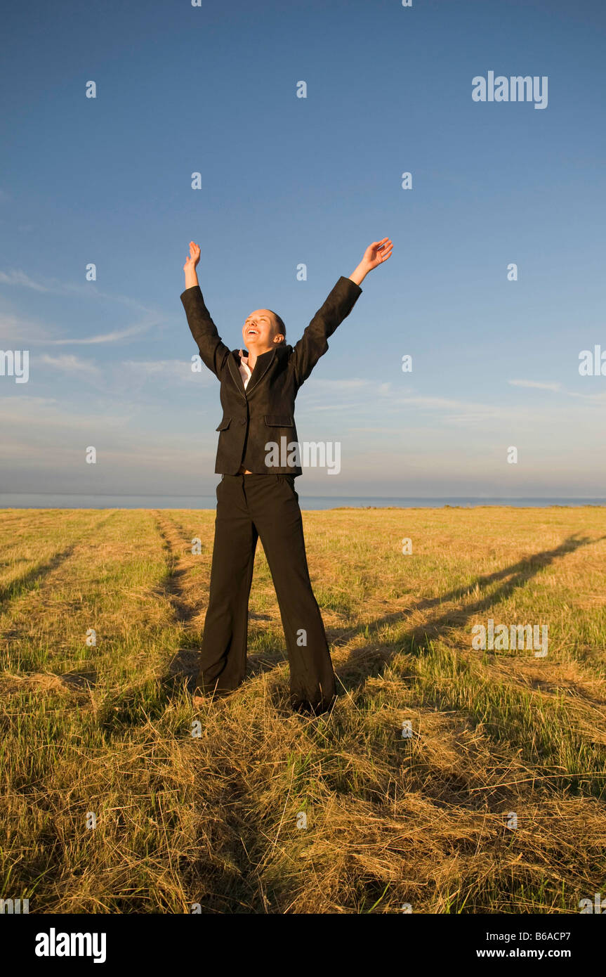 Happy businesswoman raised arms hi-res stock photography and images - Alamy