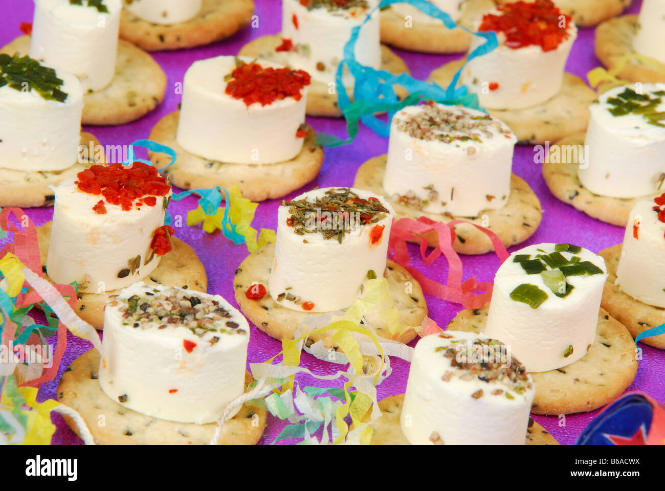 A selection of gosh-how-kitsch cheesy party nibbles on crackers Stock ...