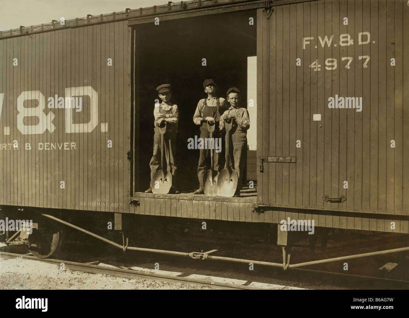 3 Boys in Box Car Stock Photo - Alamy