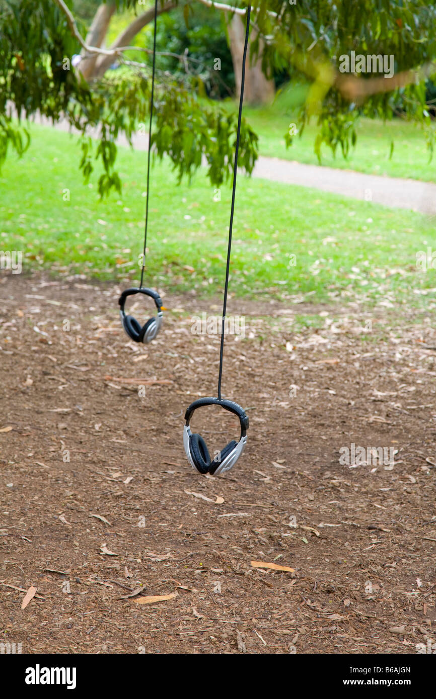 HEADPHONES HANGING FROM A SPINNING GUM EUCALYPTUS TREE AT KEW GARDENS ...