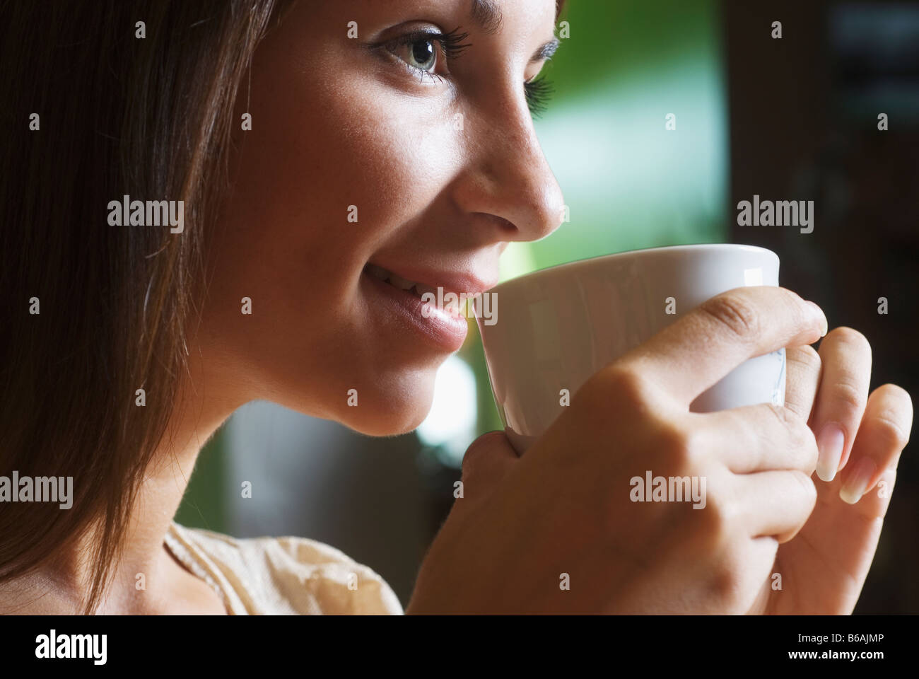 Young woman with cup Stock Photo - Alamy