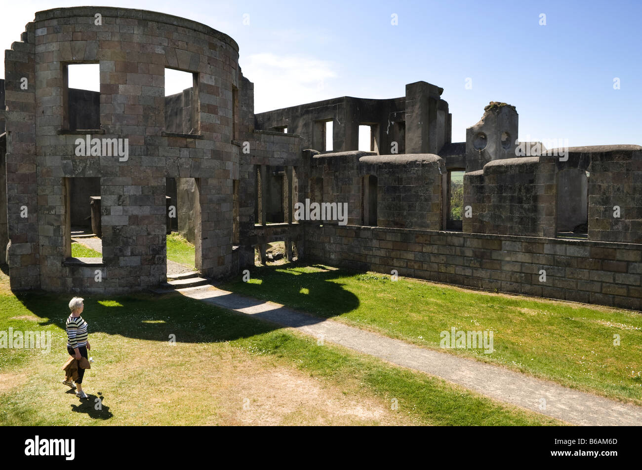 Tourist inside the ruins of the Bishops Palace near Castlerock ...