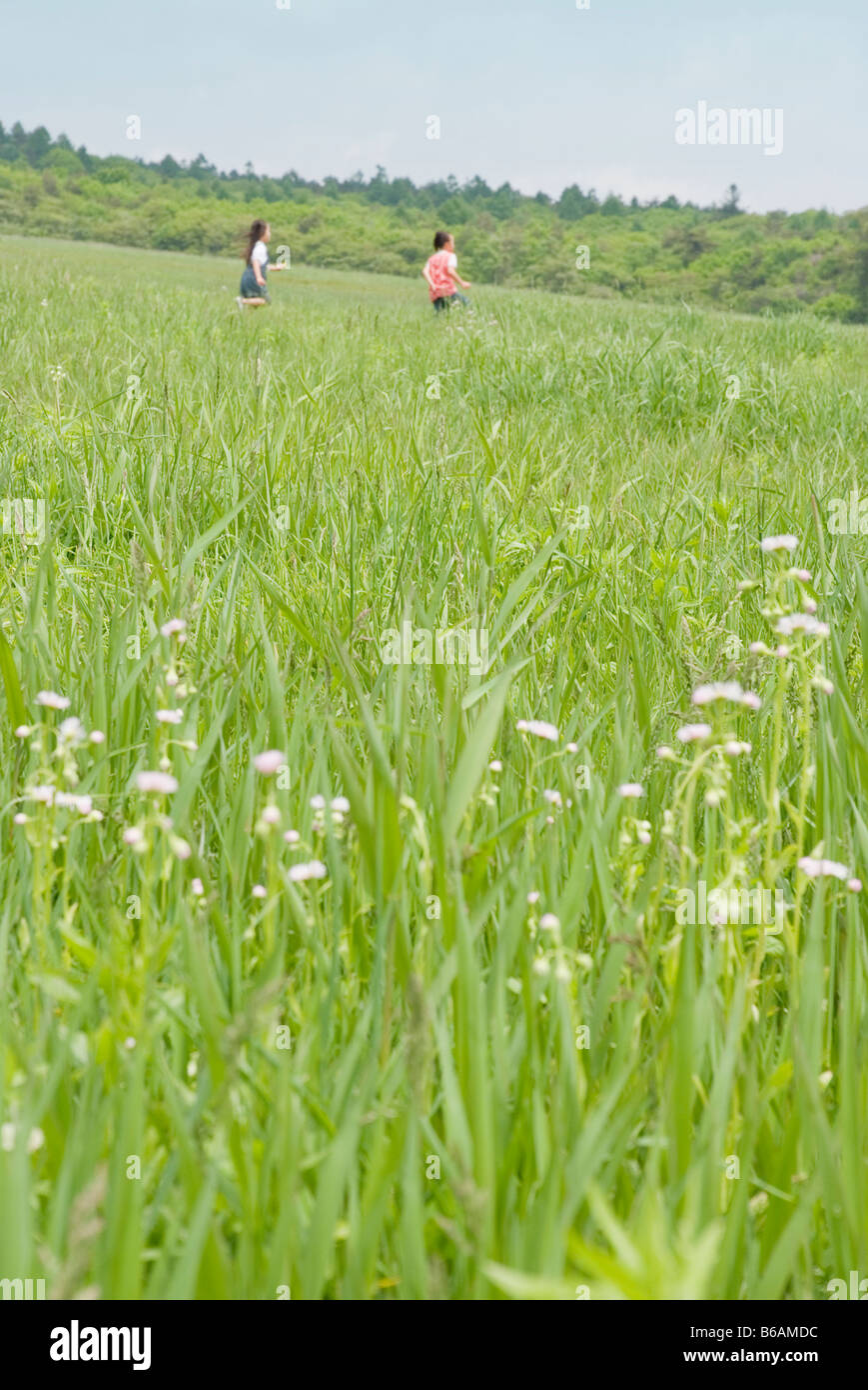 Two children running on hi-res stock photography and images - Alamy
