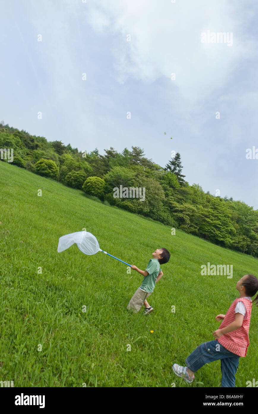 Children running with net Stock Photo - Alamy