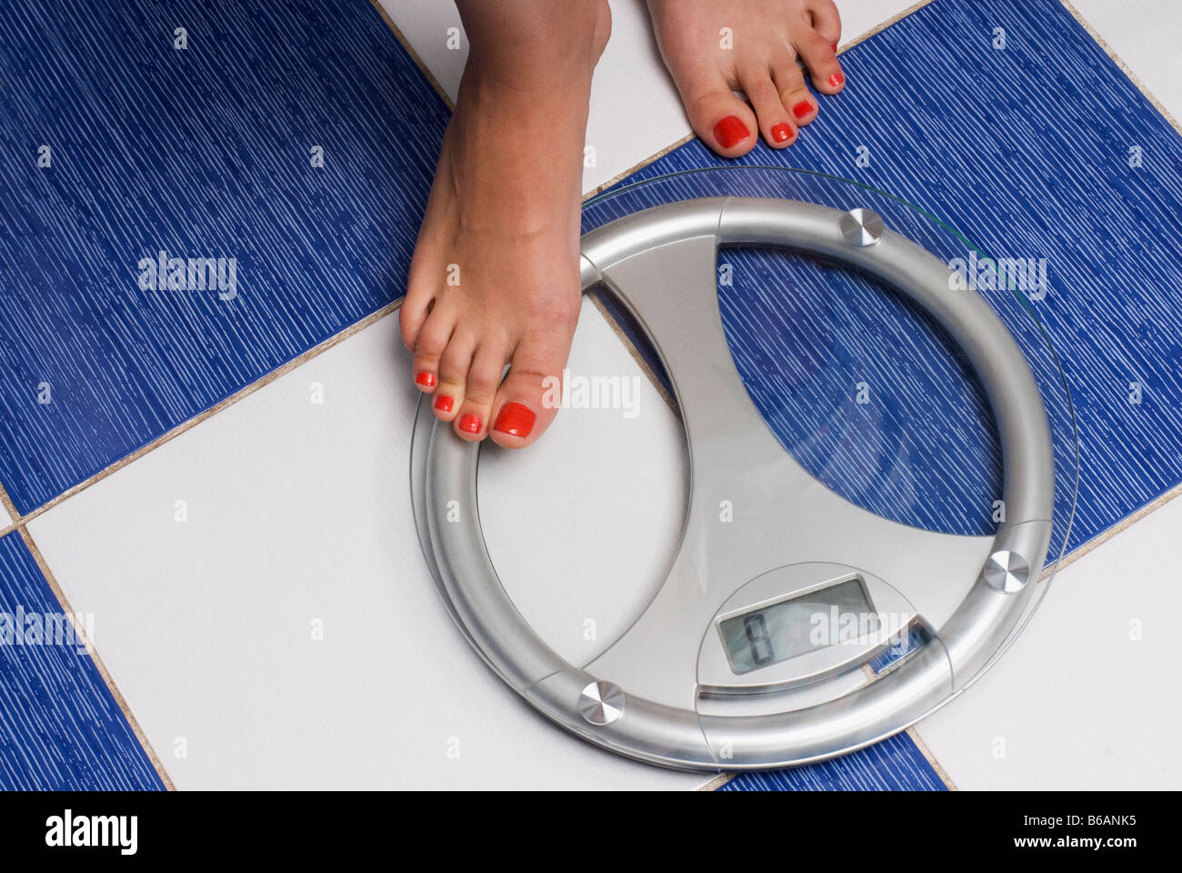 Stepping onto scales hi-res stock photography and images - Alamy