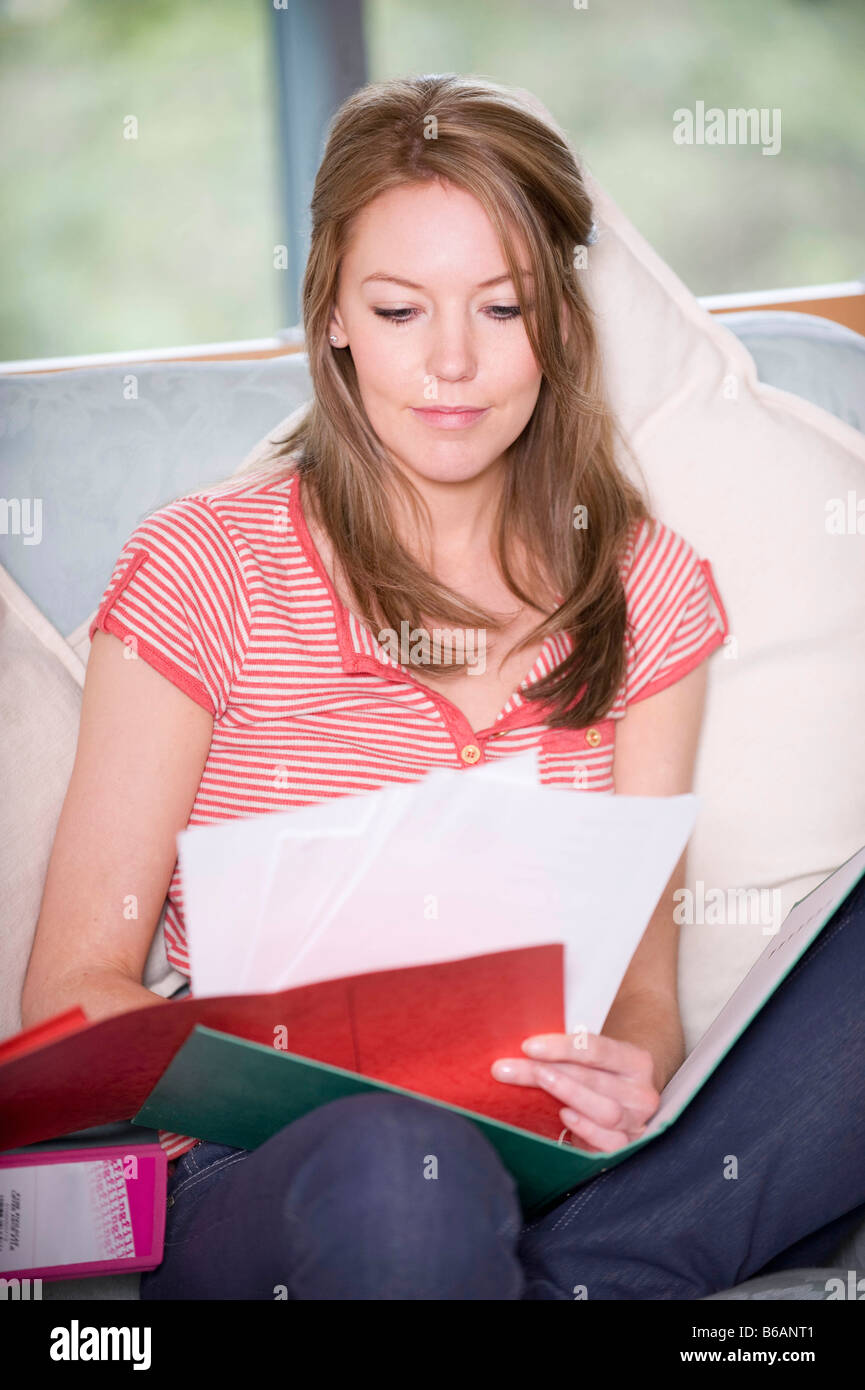 A female checking some notes Stock Photo - Alamy