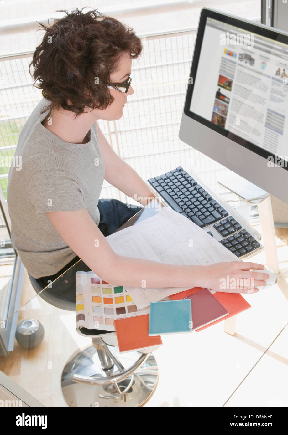 Female designer working at her computer Stock Photo - Alamy