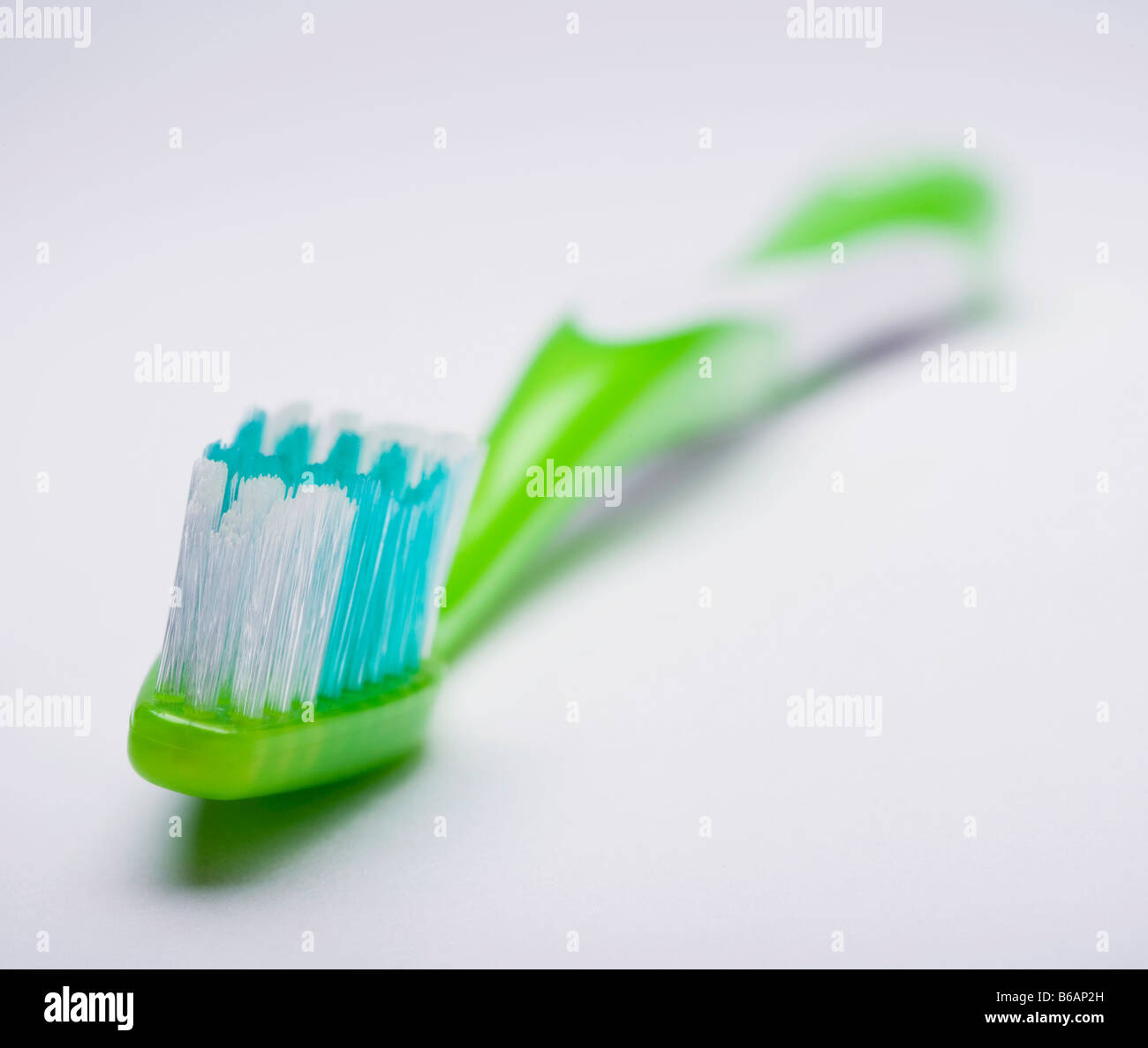 Green toothbrush, close-up Stock Photo - Alamy