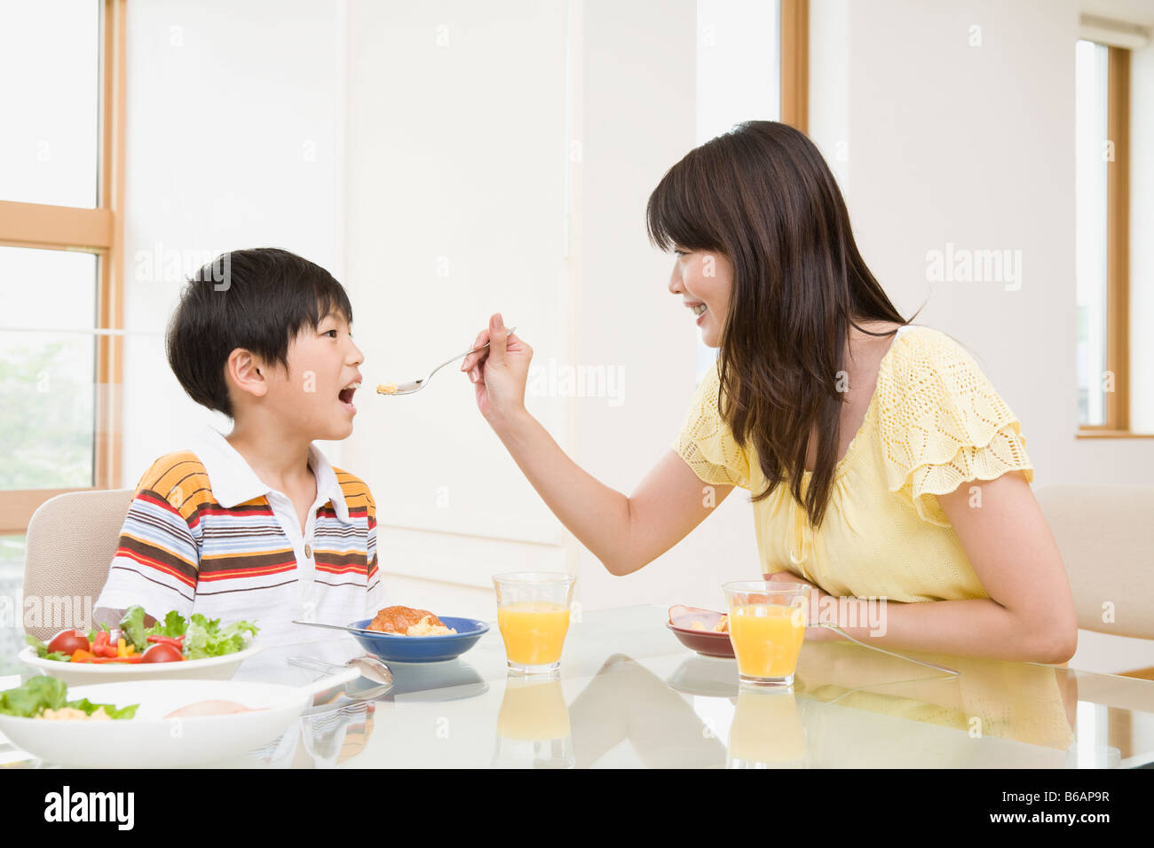 Family eating breakfast Stock Photo - Alamy