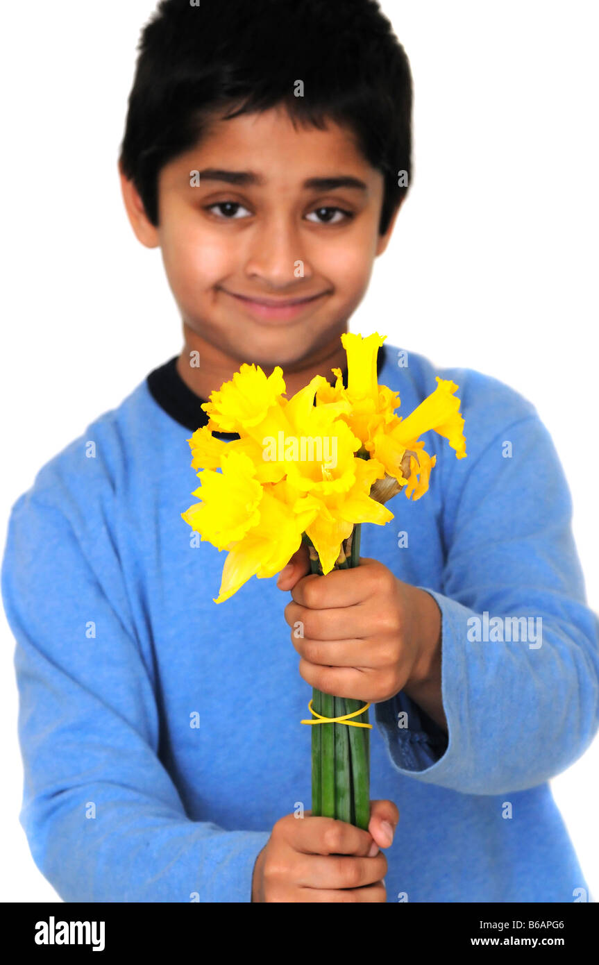 An handsome kid handing a boquet of daffodils Stock Photo - Alamy