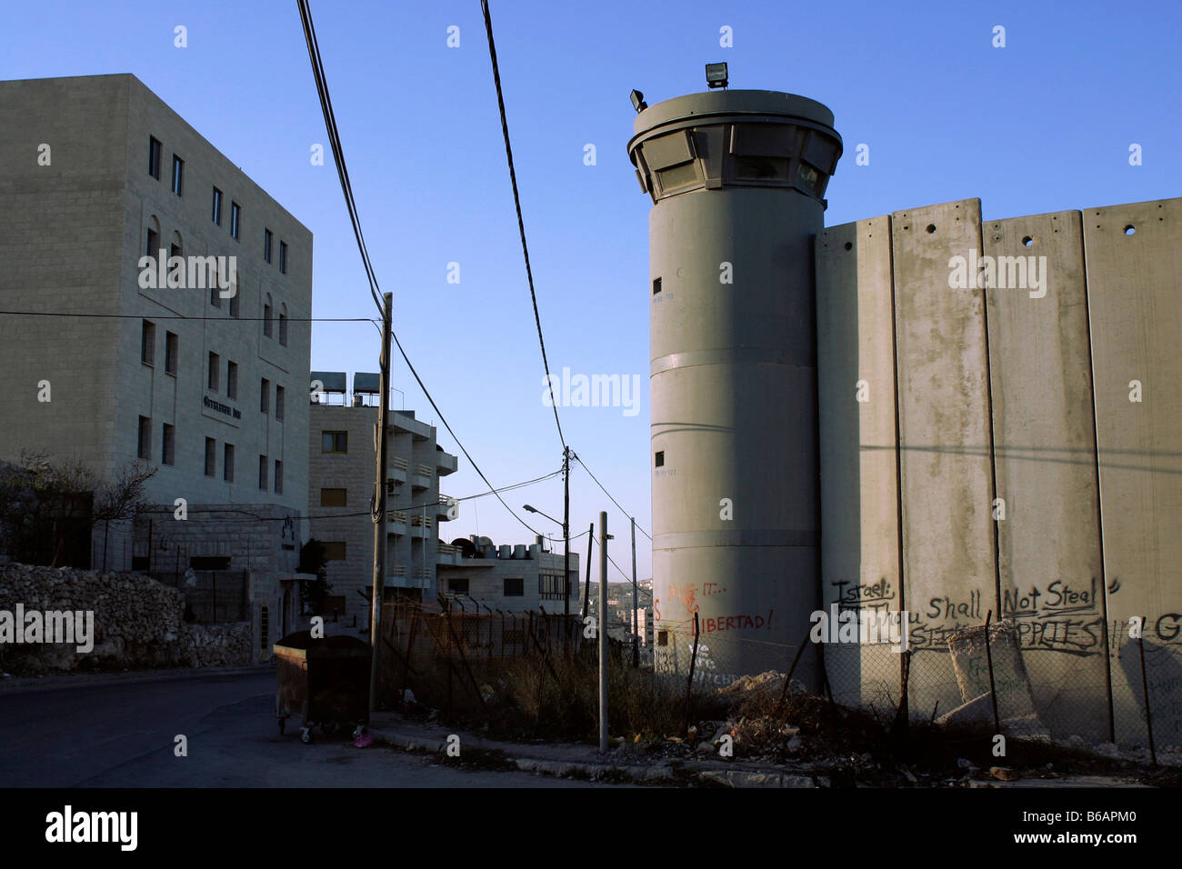 An Israeli watch tower on the separation wall faces a residential ...