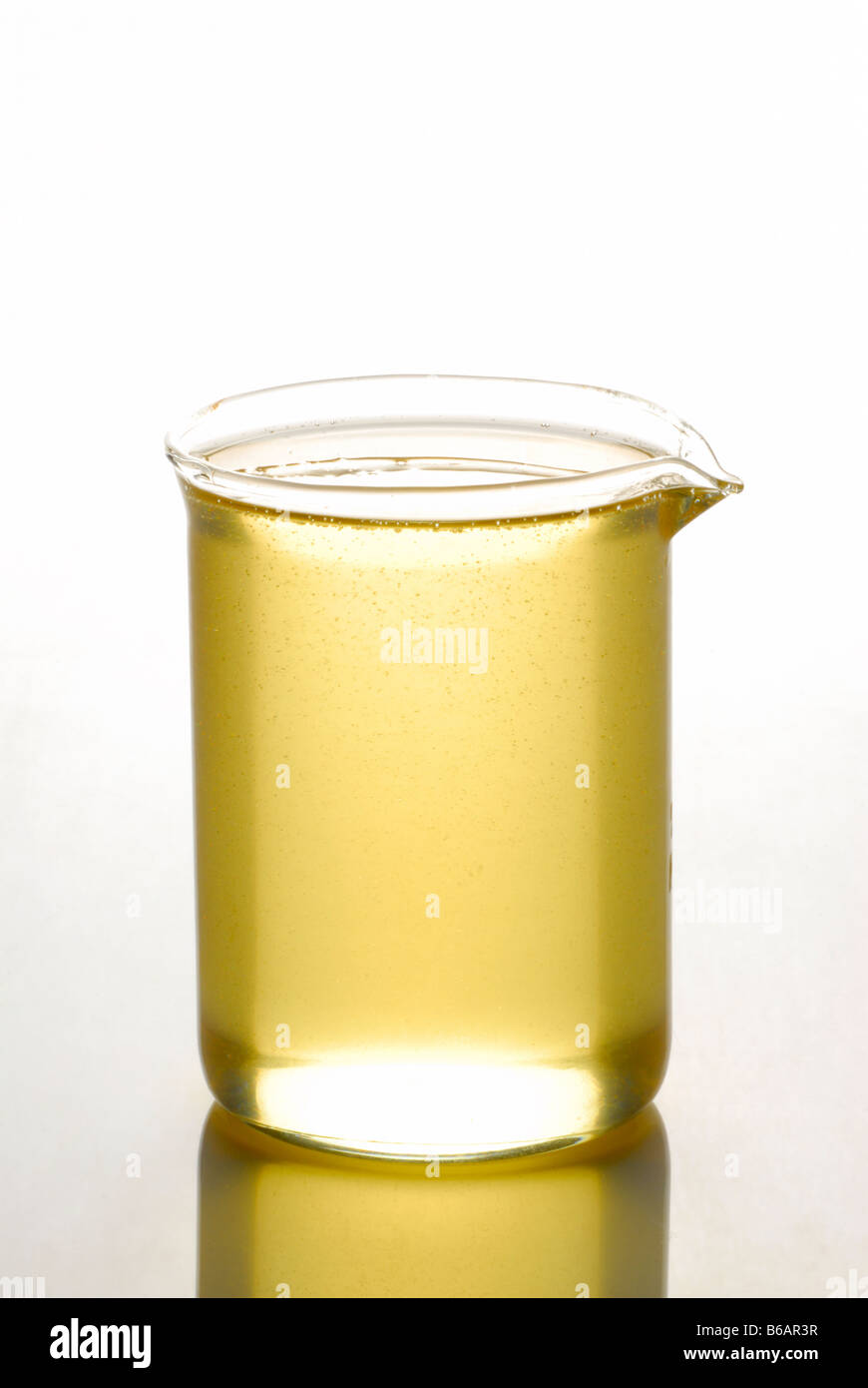 A BEAKER FILLED WITH COCONUT OIL Stock Photo - Alamy