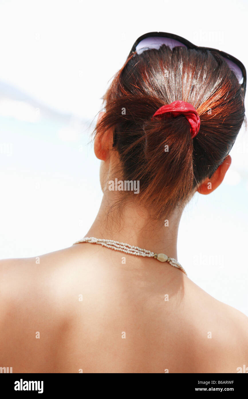 Rear view of young woman Stock Photo - Alamy