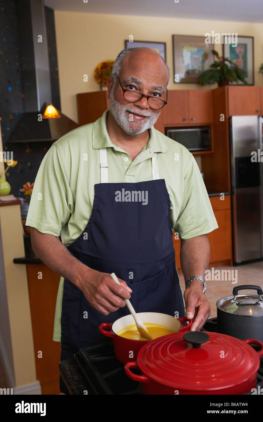 African man cooking dinner Stock Photo - Alamy