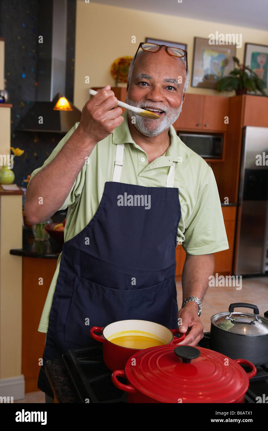 African man cooking dinner Stock Photo - Alamy