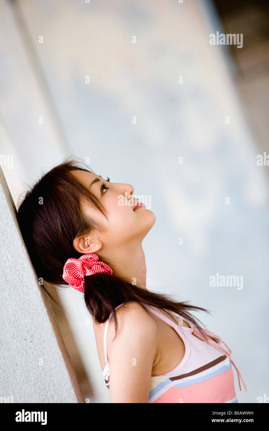 Young woman looking up Stock Photo - Alamy