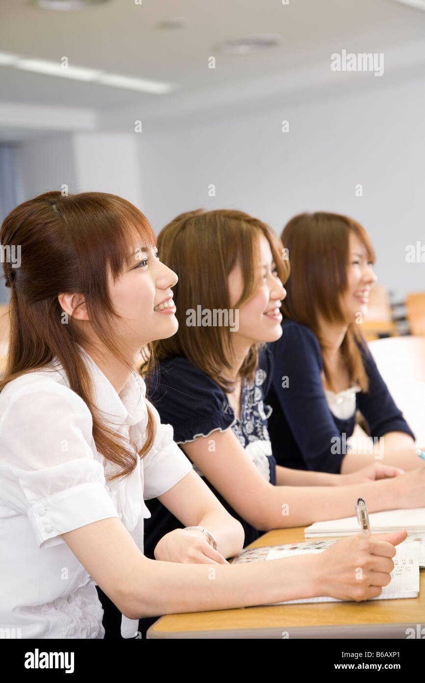 Three young women studying at college Stock Photo - Alamy