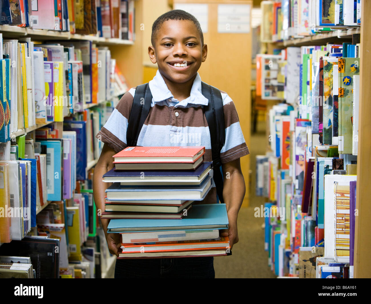 African boy reading book library hi-res stock photography and images ...