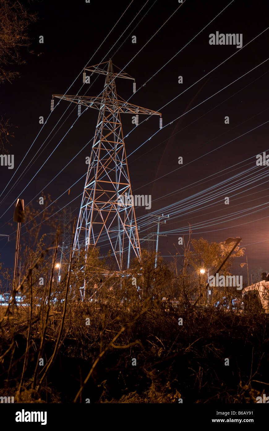 Electric transmission tower at night Stock Photo - Alamy