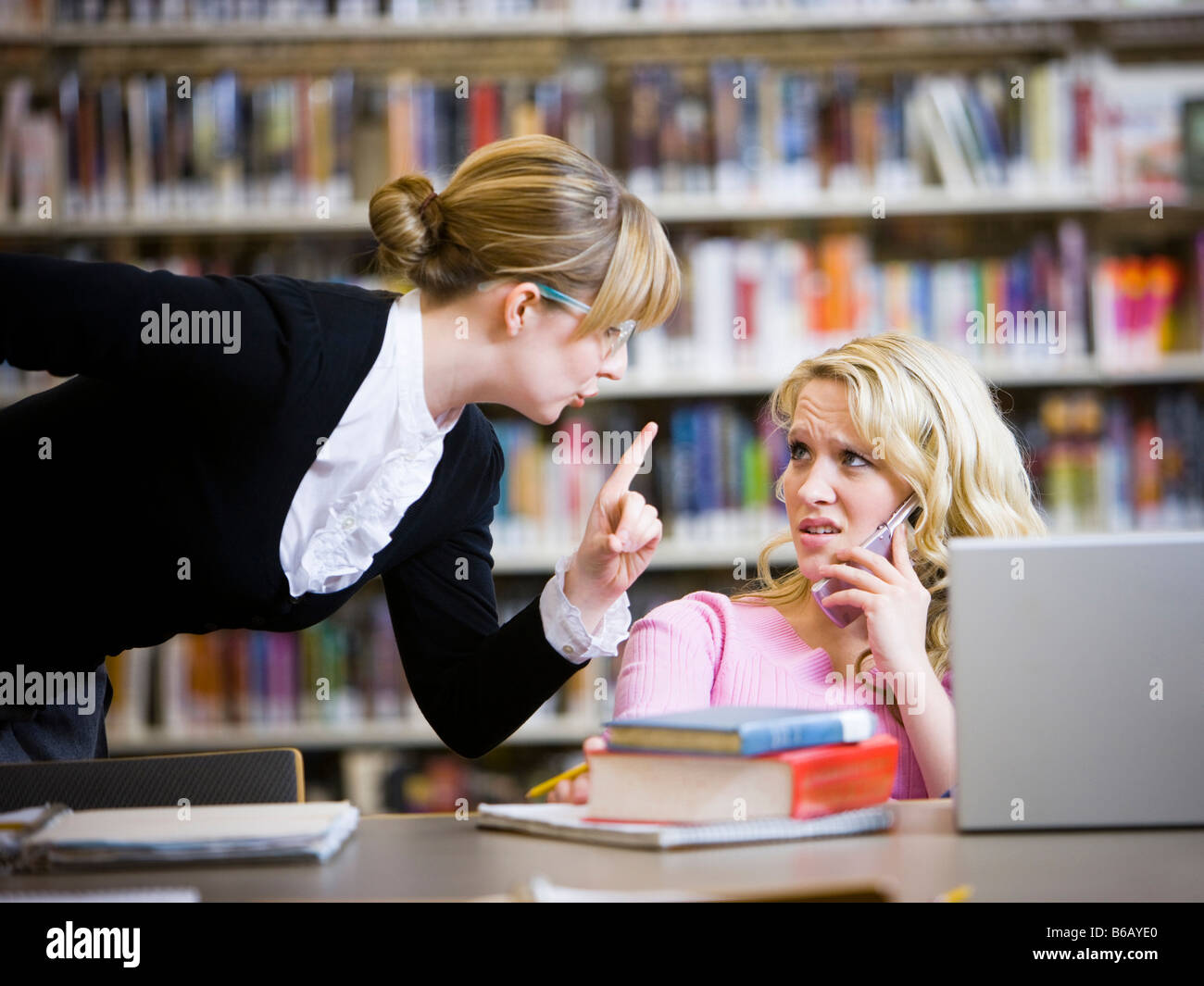 Shushing in library hi-res stock photography and images - Alamy