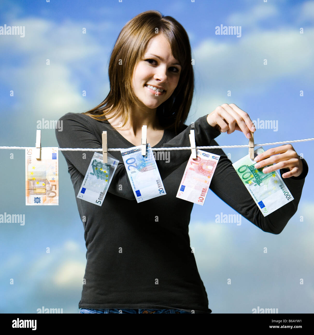 Woman hanging money out dry hi-res stock photography and images - Alamy