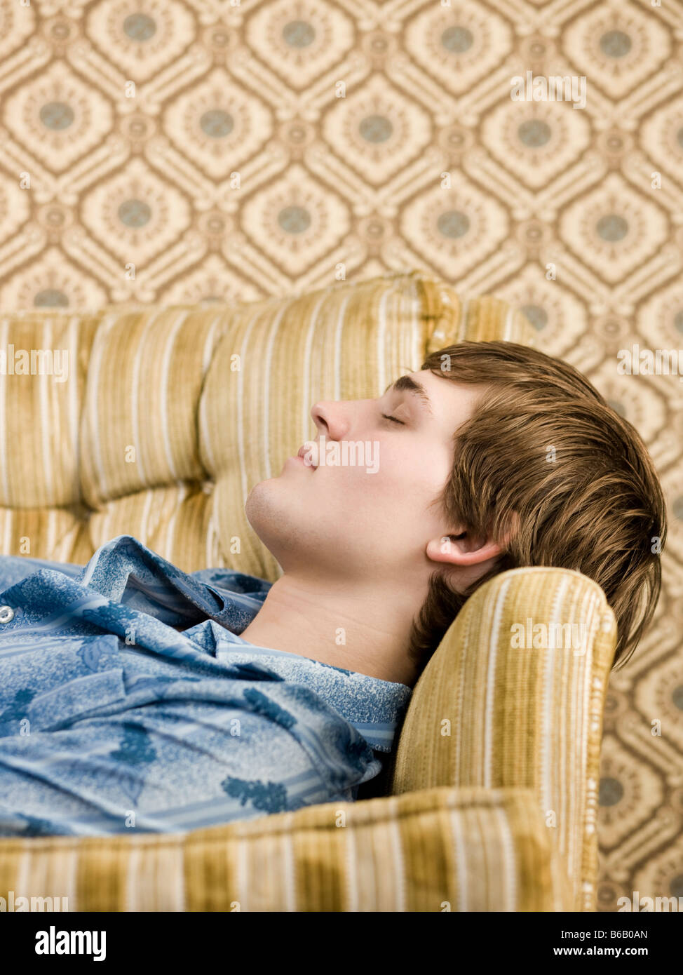 man asleep on the couch Stock Photo - Alamy