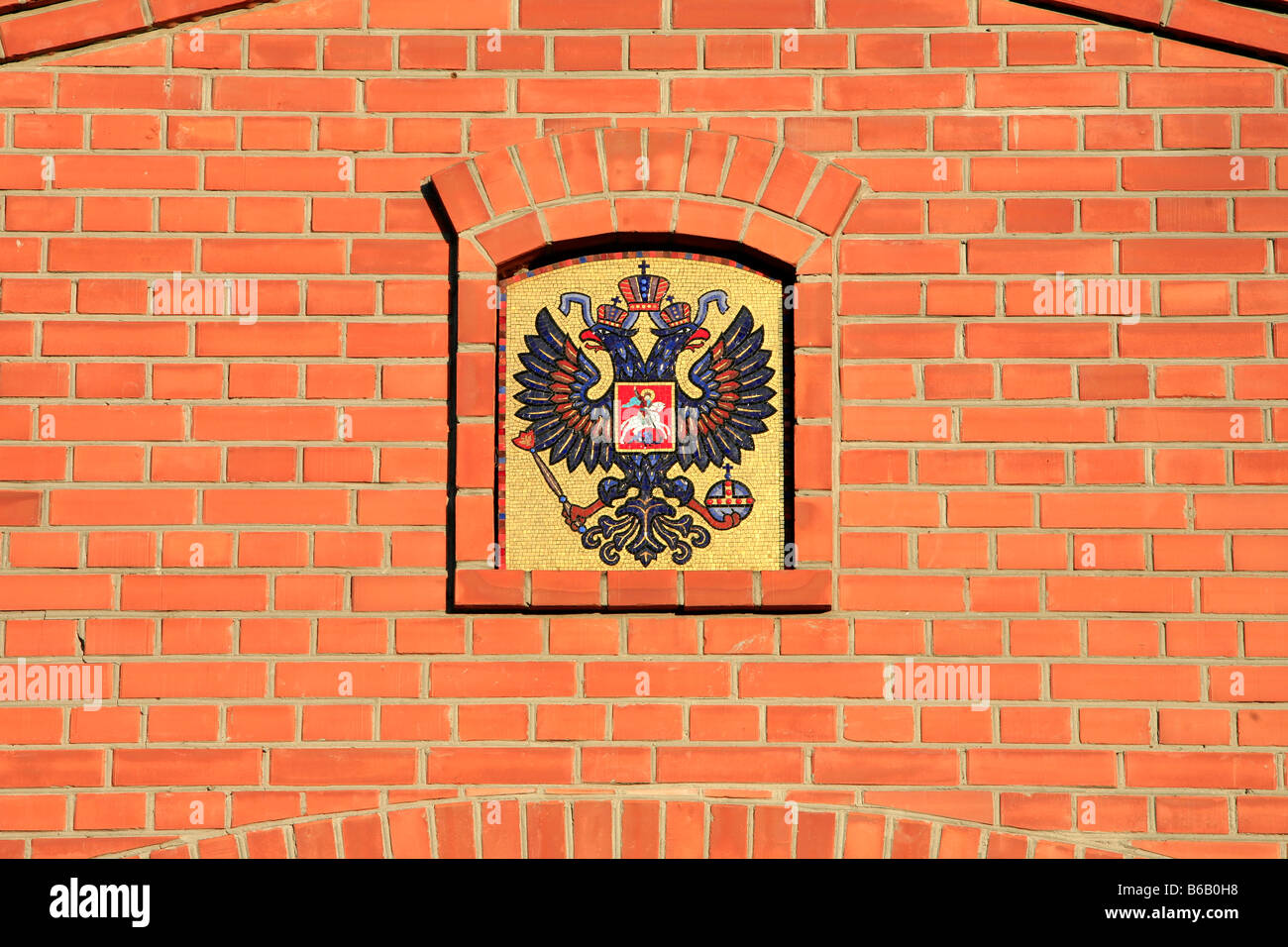 A double-headed eagle (coat of arms of the Russian Federation) above ...