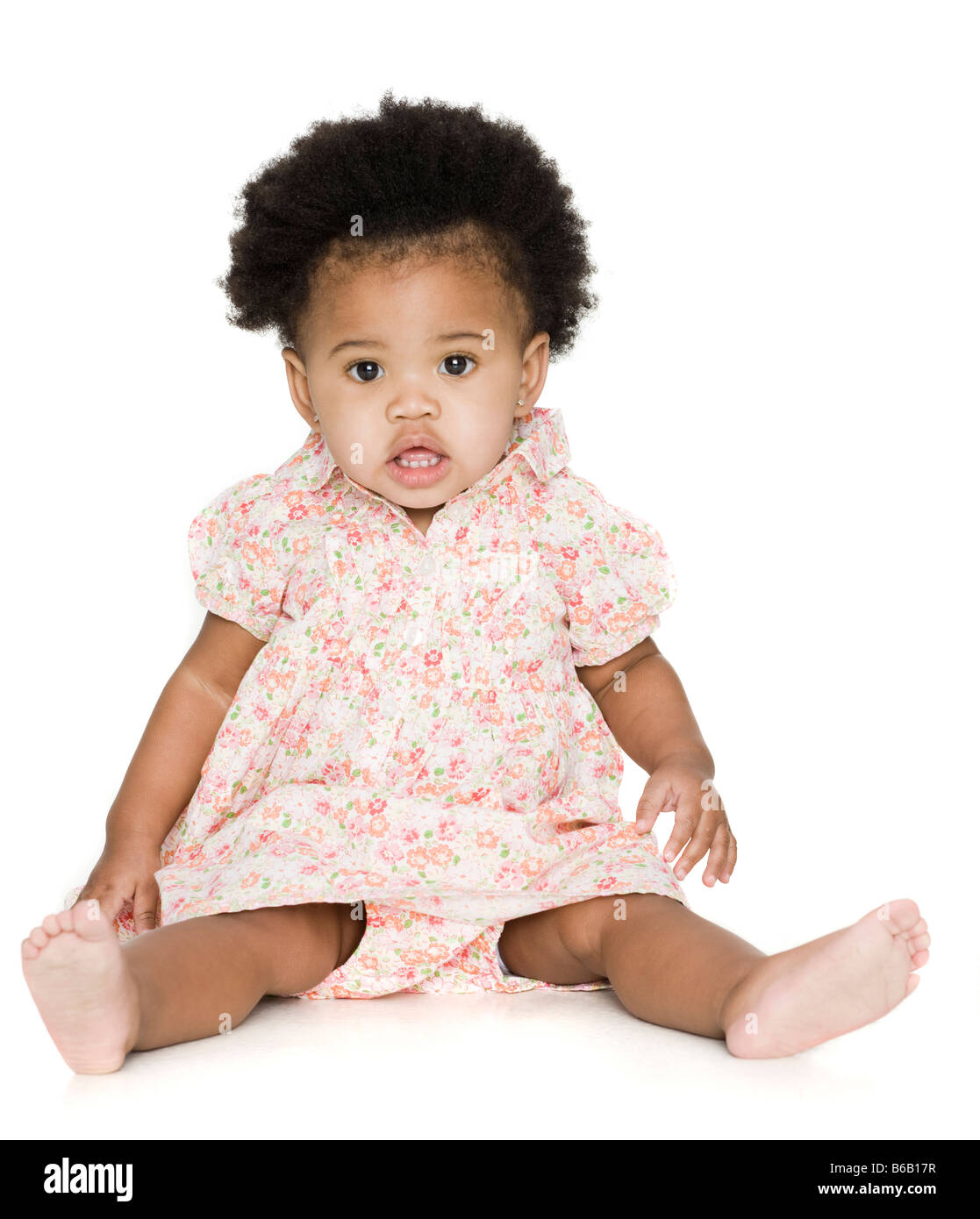 Baby sitting down Stock Photo - Alamy