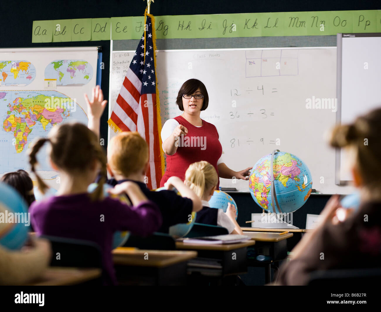 teacher in a classroom Stock Photo - Alamy