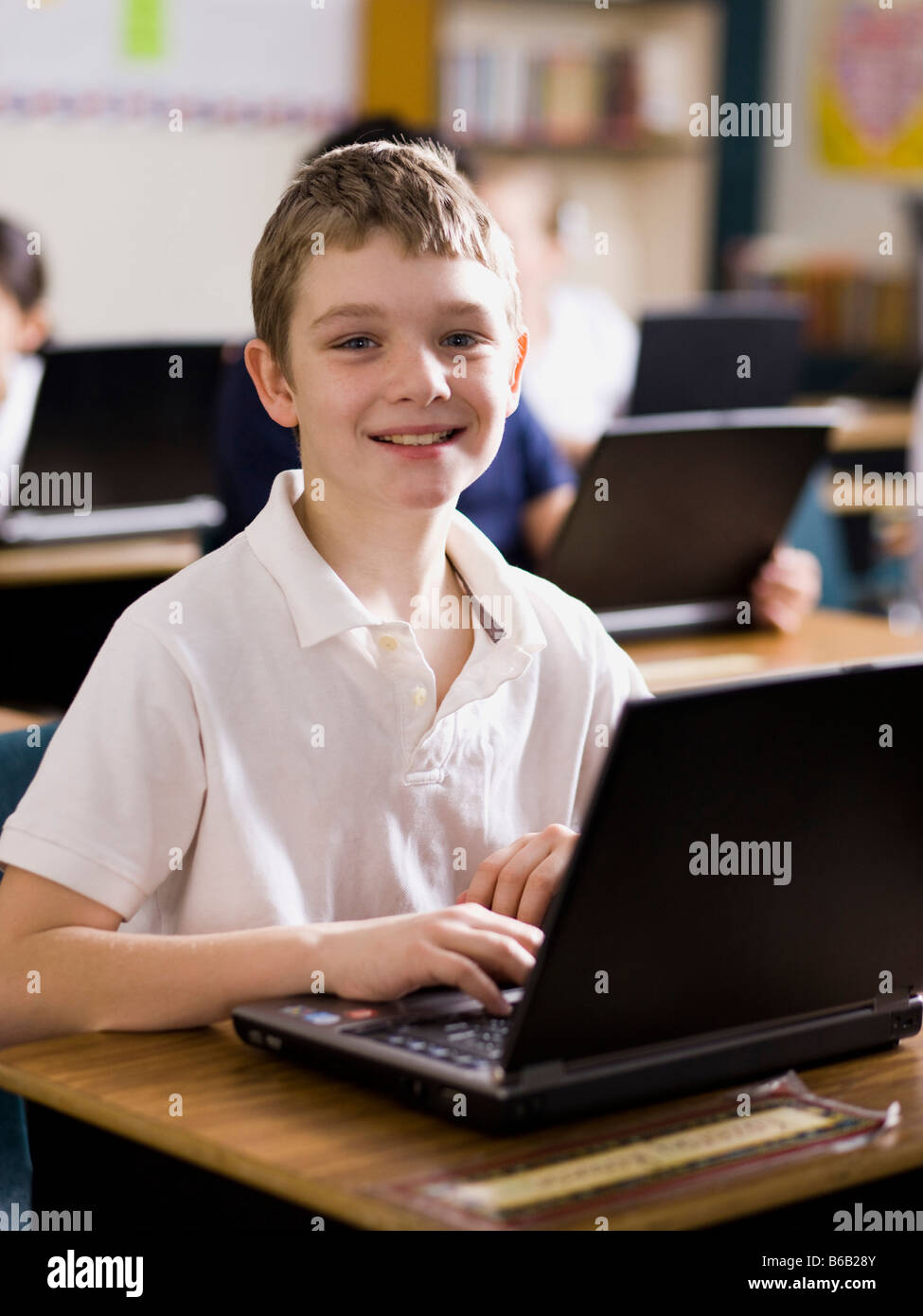 boy with laptop at school Stock Photo - Alamy