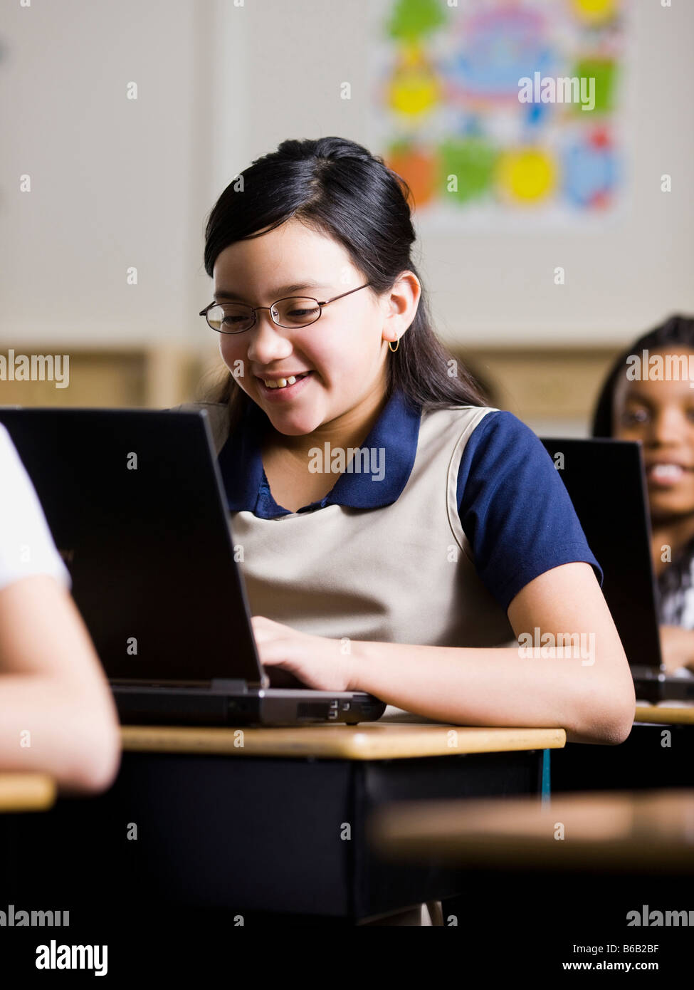 girl with laptop in classroom Stock Photo - Alamy