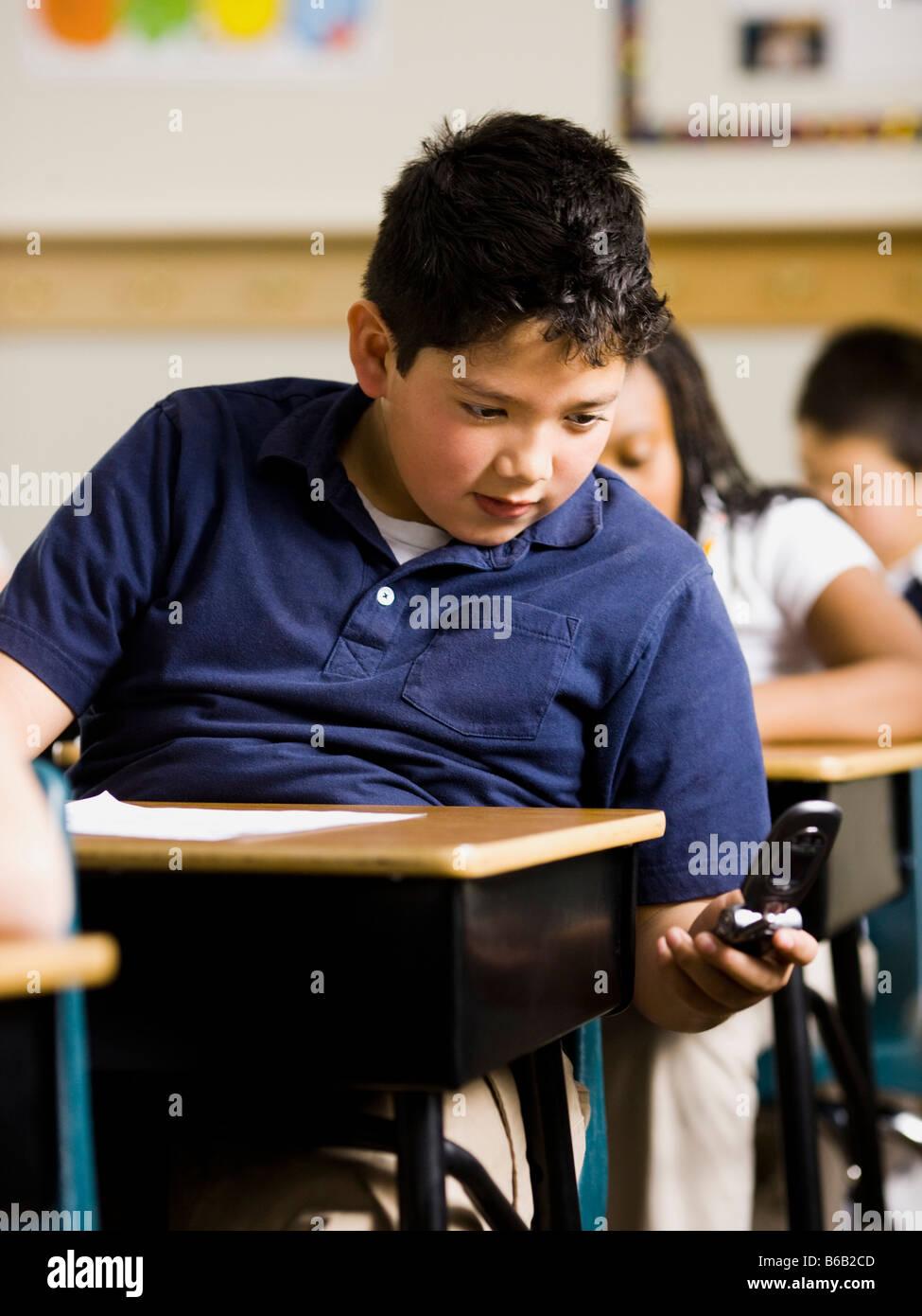 boy texting in school Stock Photo - Alamy