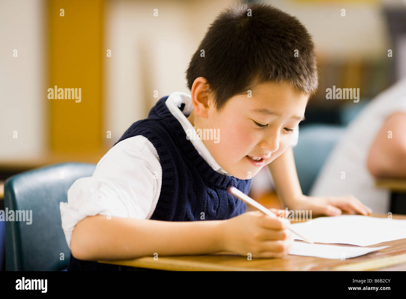 boy in a classroom Stock Photo - Alamy