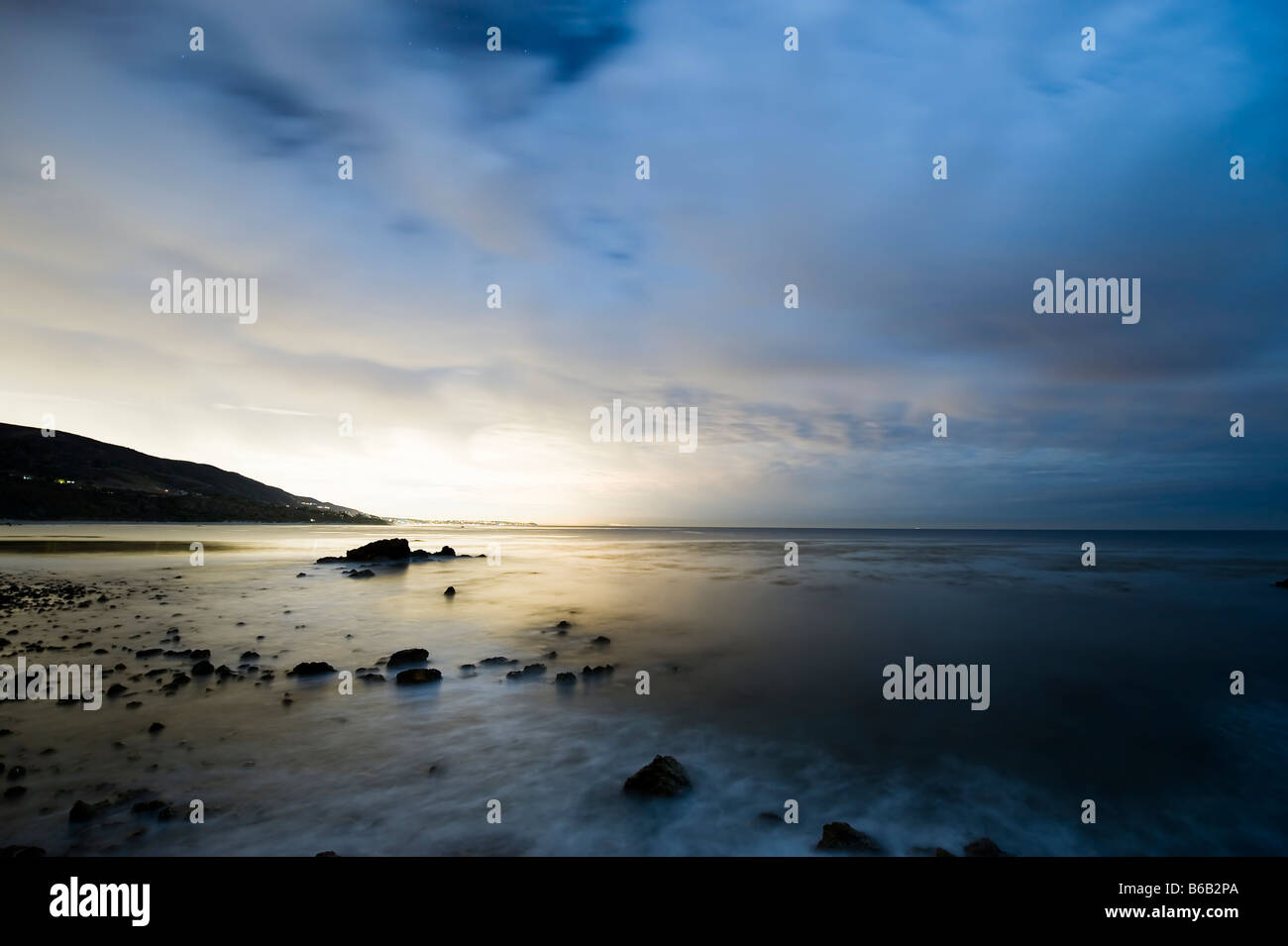 Beach at night with city lights from Malibu Stock Photo - Alamy