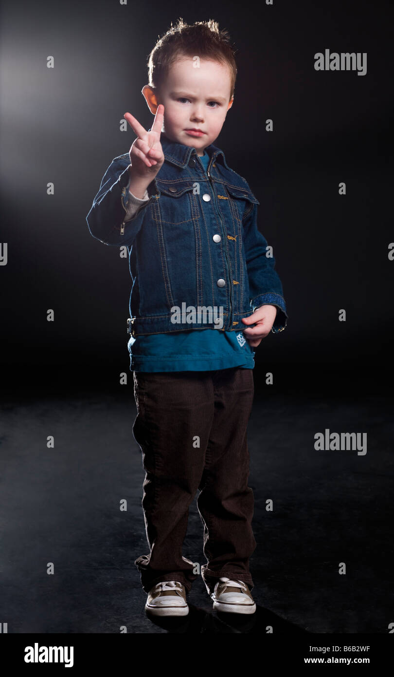 little boy making peace sign Stock Photo - Alamy