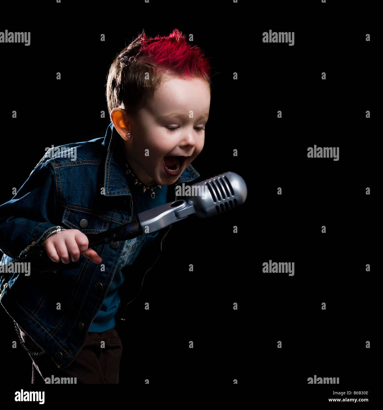little boy singing into a microphone Stock Photo - Alamy
