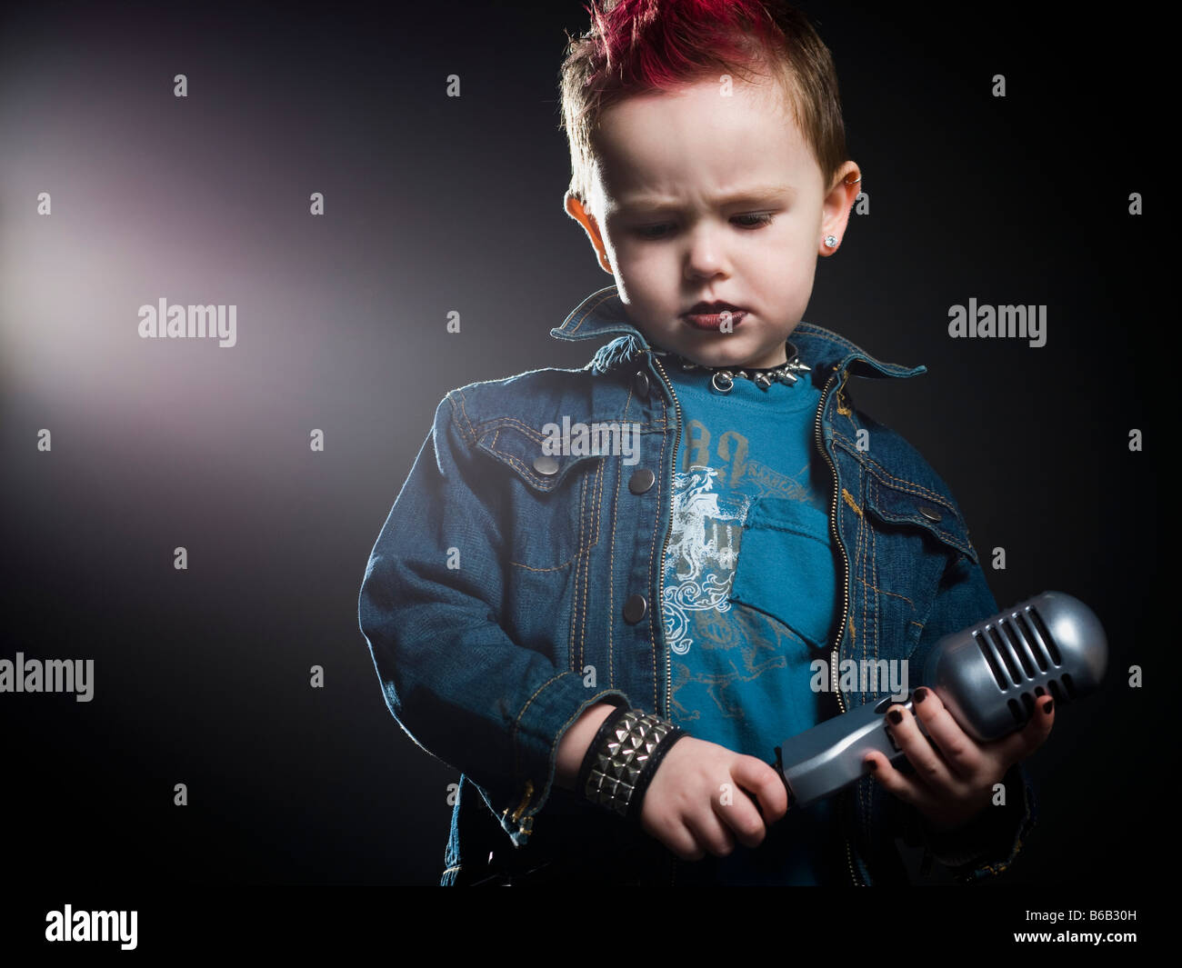 little boy singing into a microphone Stock Photo - Alamy