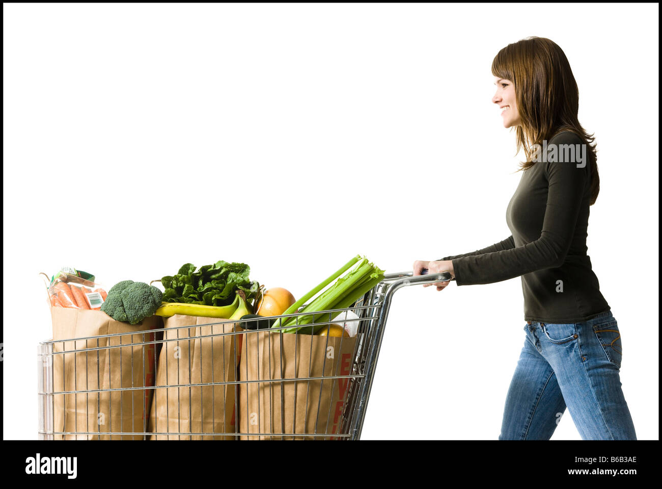 woman pushing a shopping cart Stock Photo - Alamy