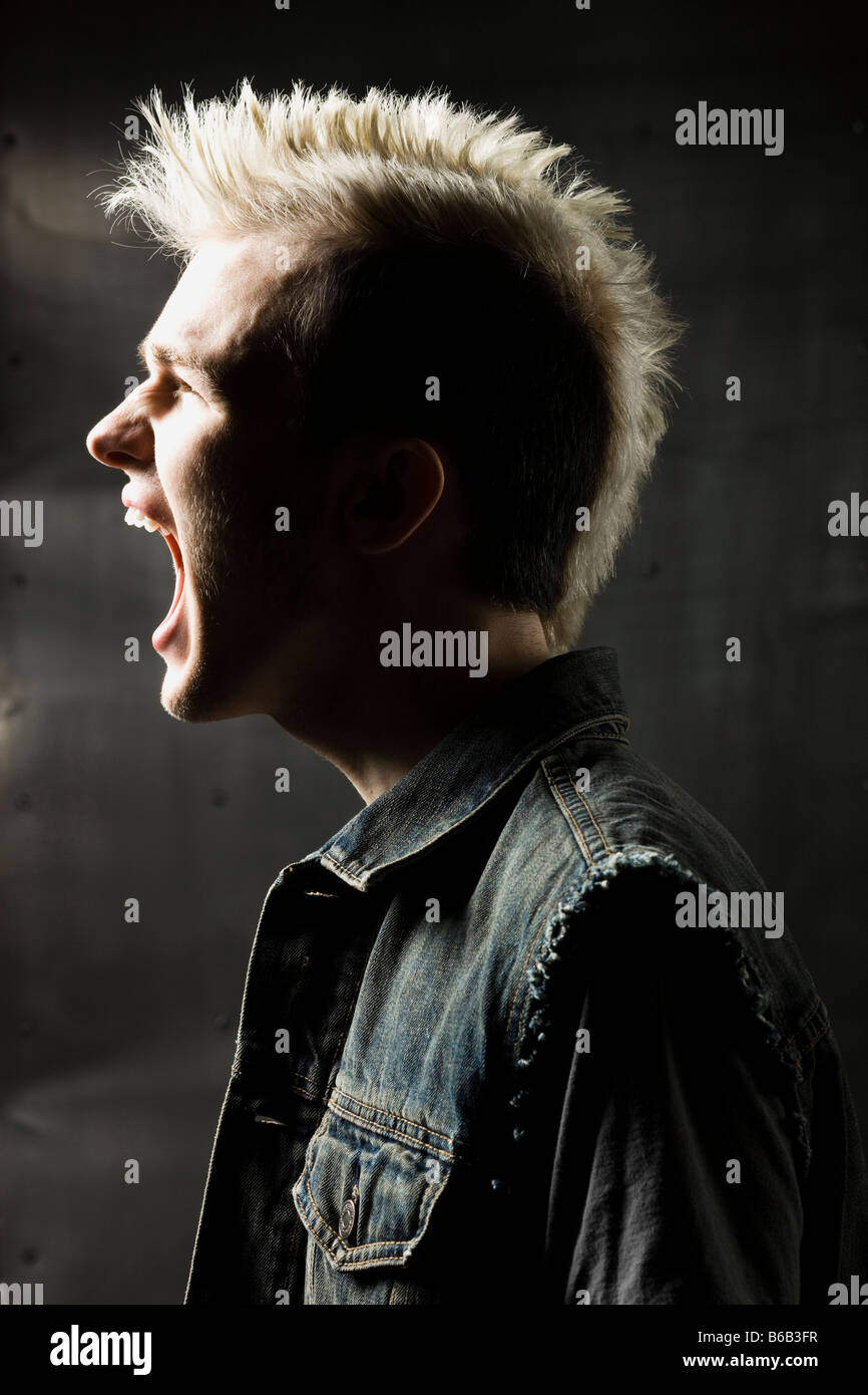 Man with a mohawk singing hi-res stock photography and images - Alamy