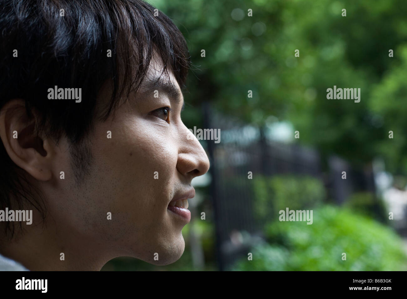 Profile of Japanese man outdoors Stock Photo - Alamy