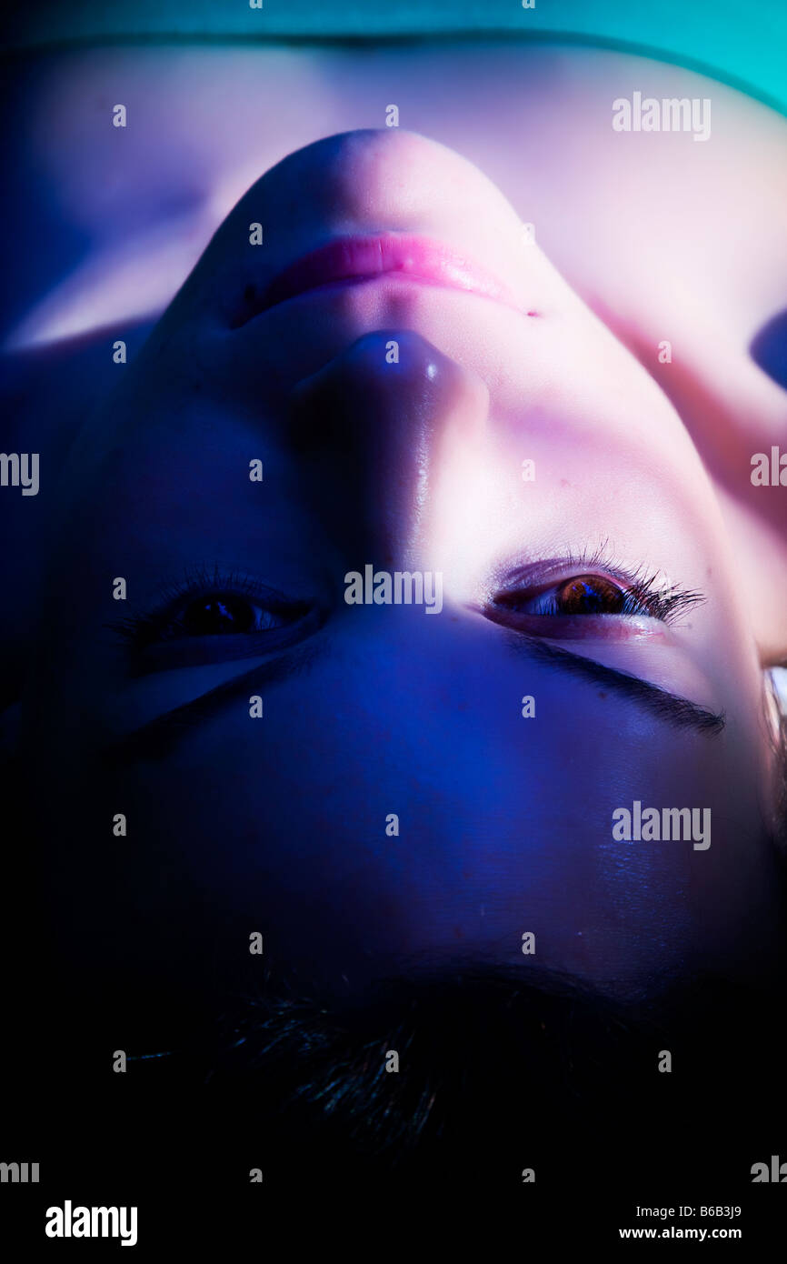Thoughtful woman face in the shadow Stock Photo - Alamy