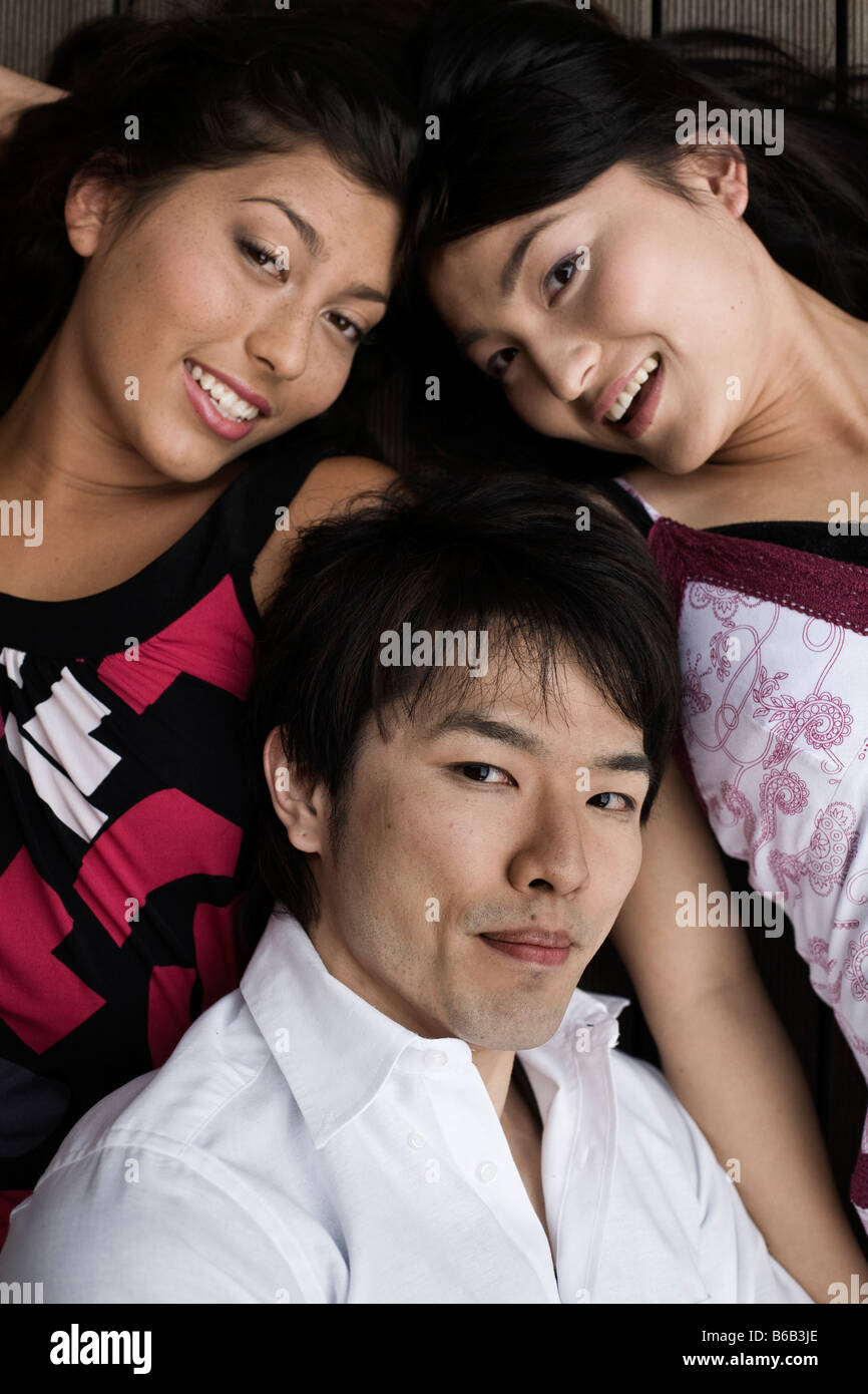 Japanese friends laying together Stock Photo - Alamy
