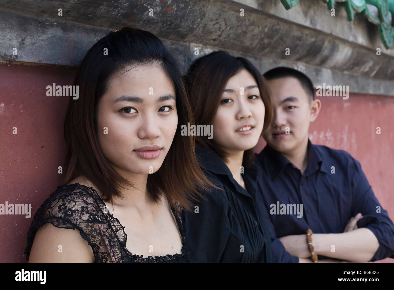 Chinese friends sitting outdoors Stock Photo - Alamy