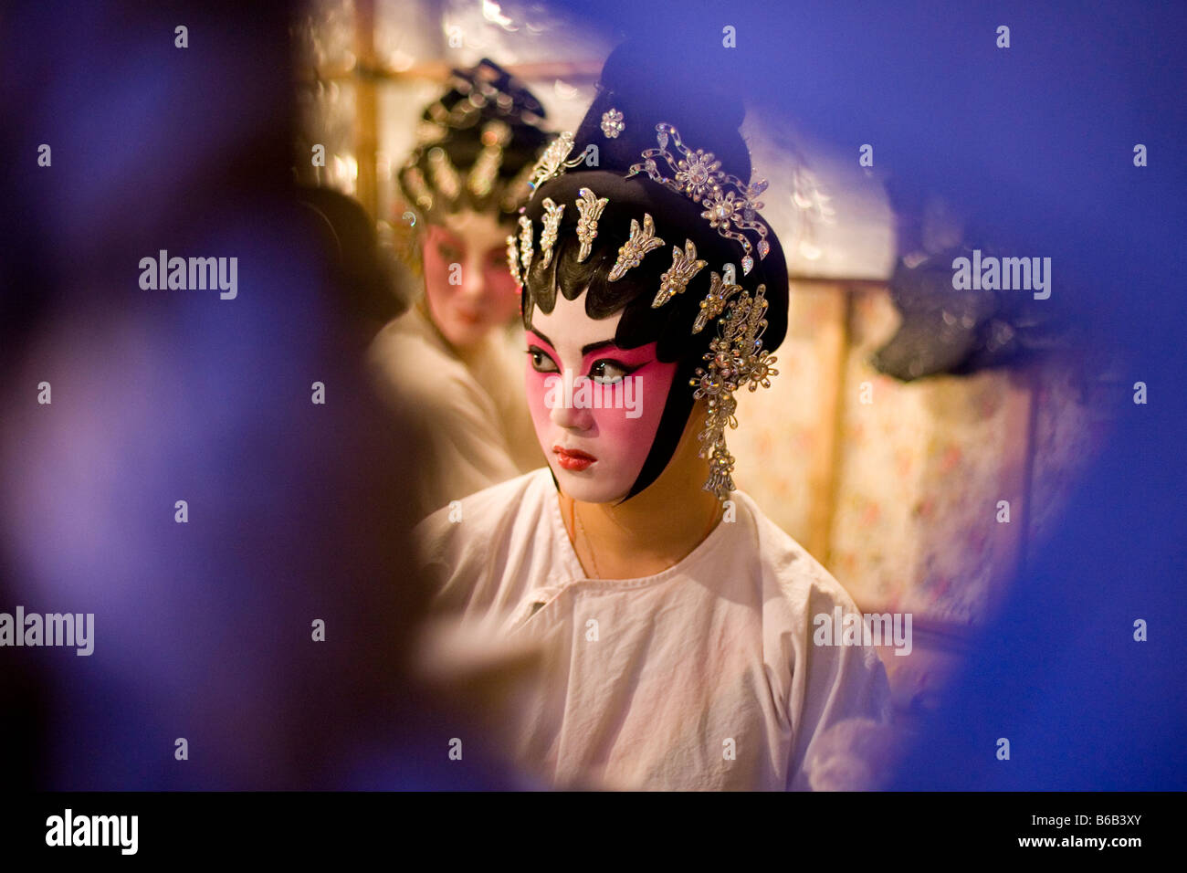 Performers of Chinese opera wait back stage in Shek O, Hong Kong, China ...