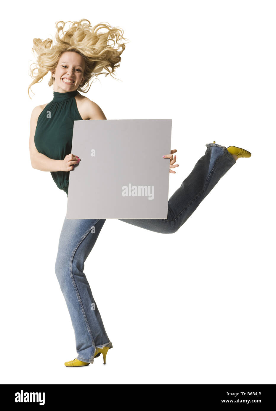 woman jumping with sign Stock Photo - Alamy