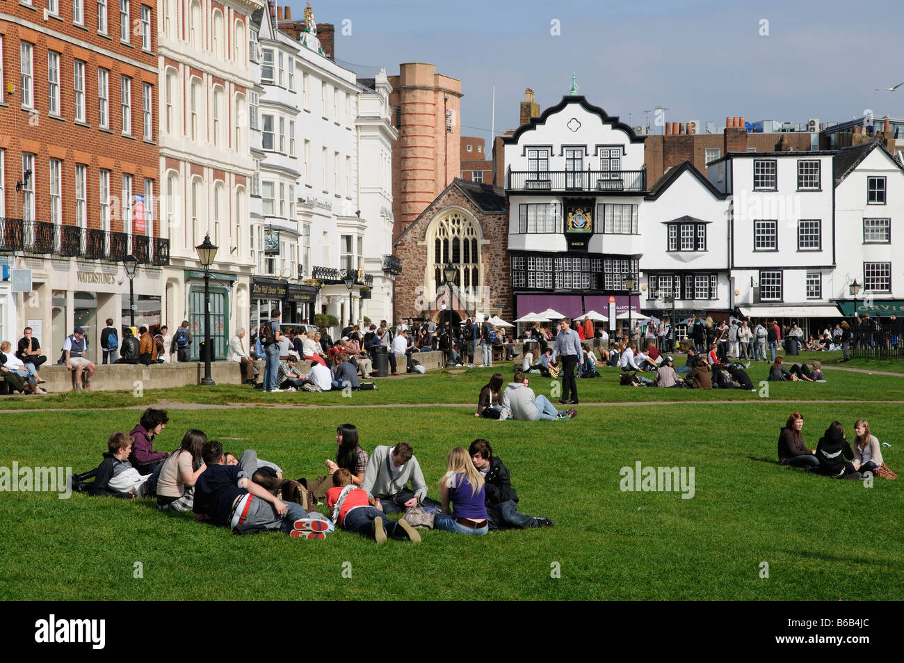Cathedral Green historic buildings and visitors in Exeter city centre ...