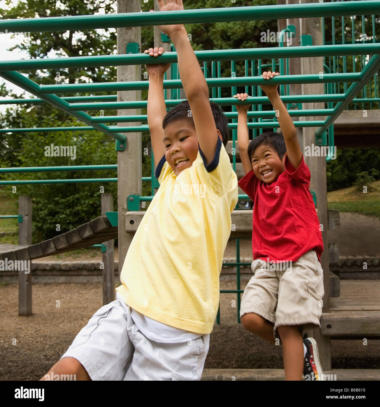 Asian boys crossing monkey bars hi-res stock photography and images - Alamy
