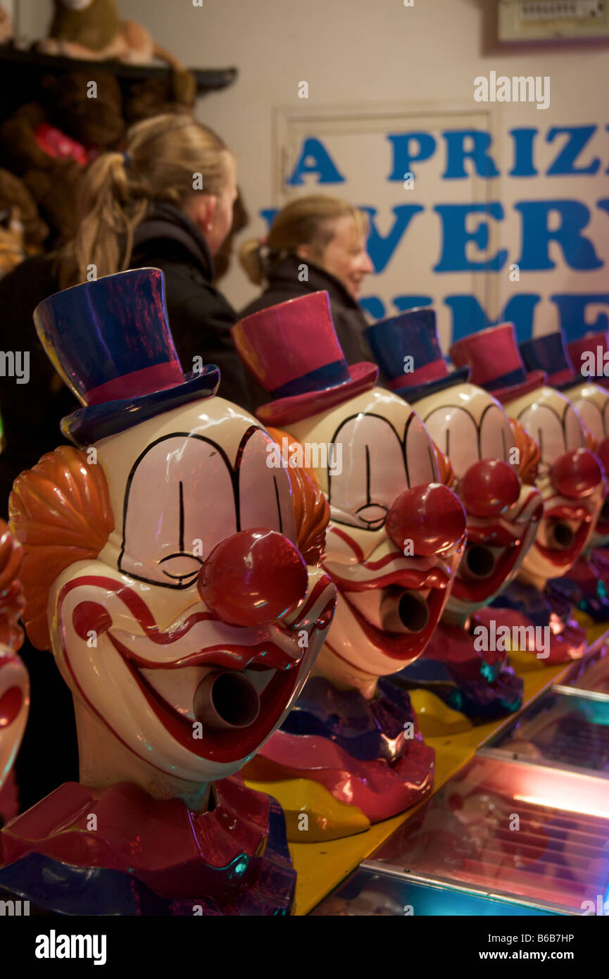 A row of plastic clowns which form part of a fairground attraction ...